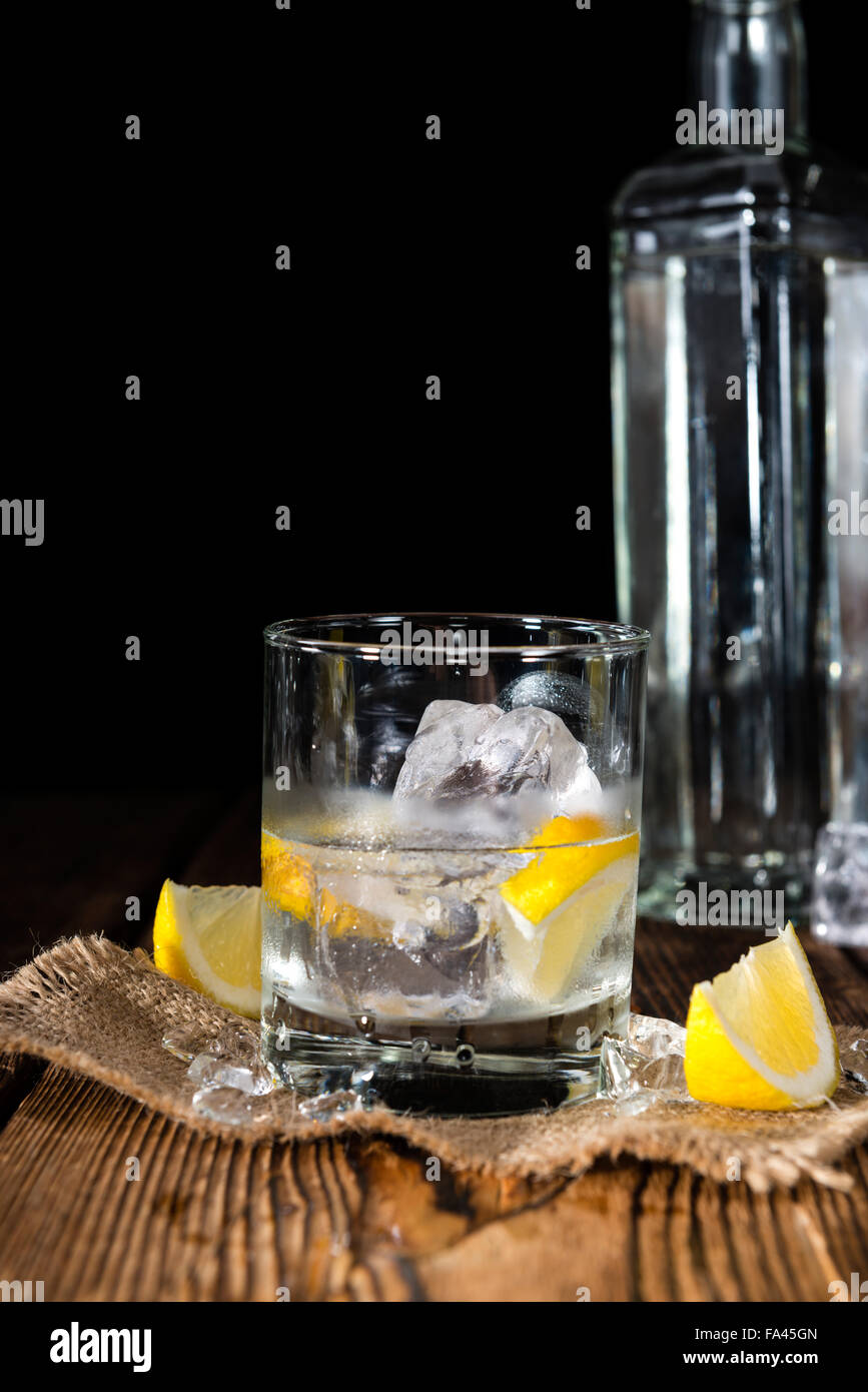 Pure Vodka (on an old wooden table) as detailed close-up shot Stock ...
