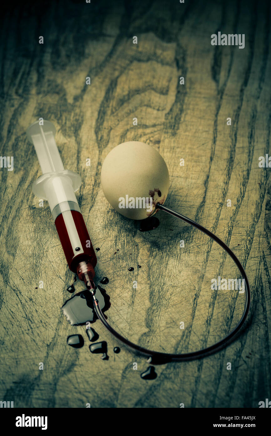 Bloody experiments on chicken eggs Stock Photo - Alamy