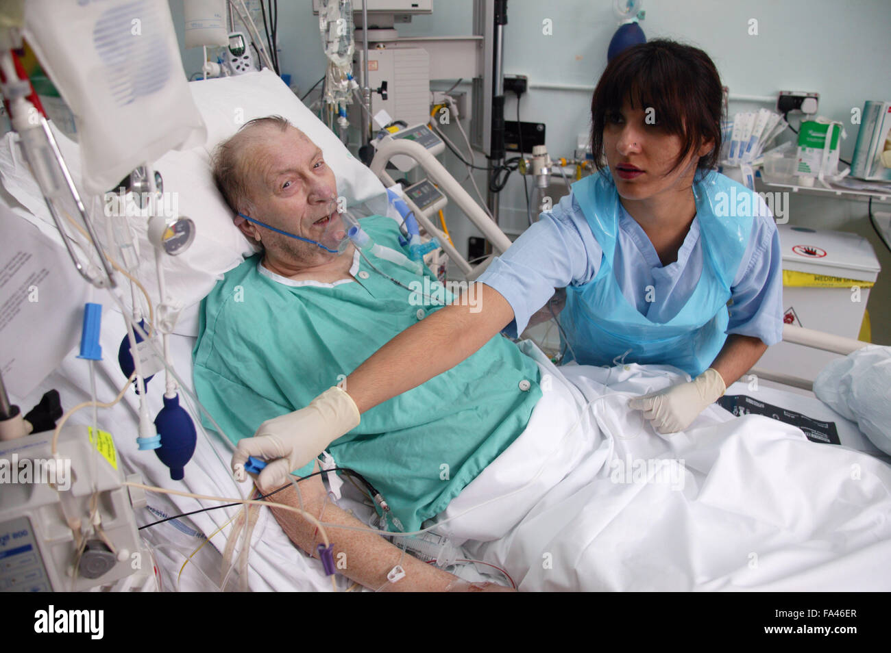 Staff Nurse attending to patient in the Adult Intensive Care Unit Stock ...