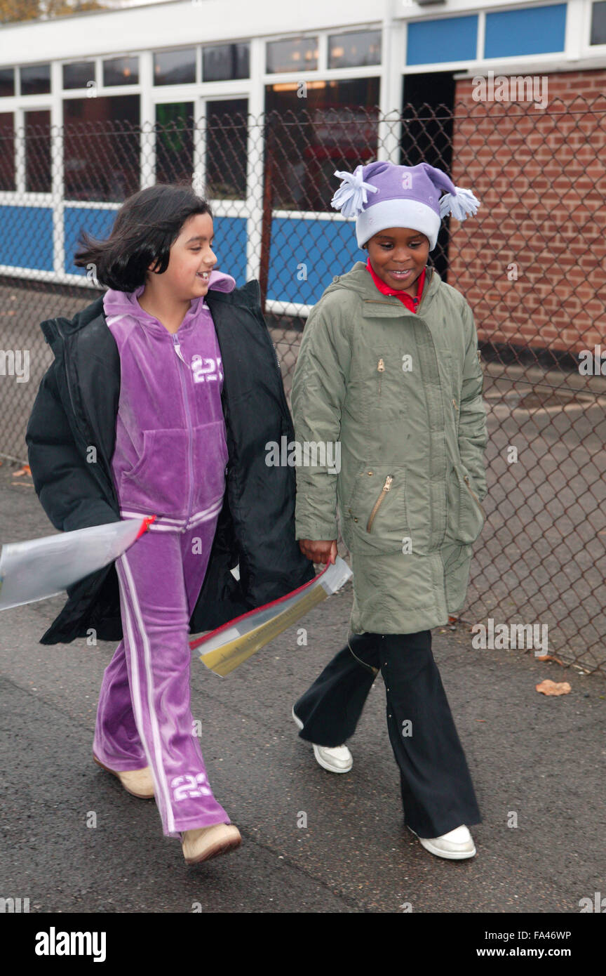 Two children walking to school Stock Photo - Alamy