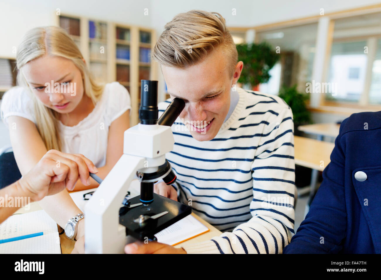 Multi ethnic student microscope hi-res stock photography and images - Alamy