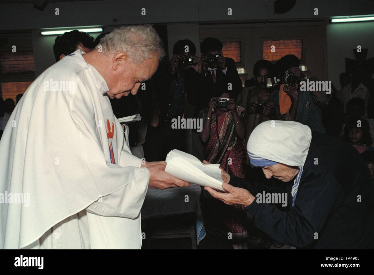 Mother Teresa offers the handwritten vows of the sisters who took their ...