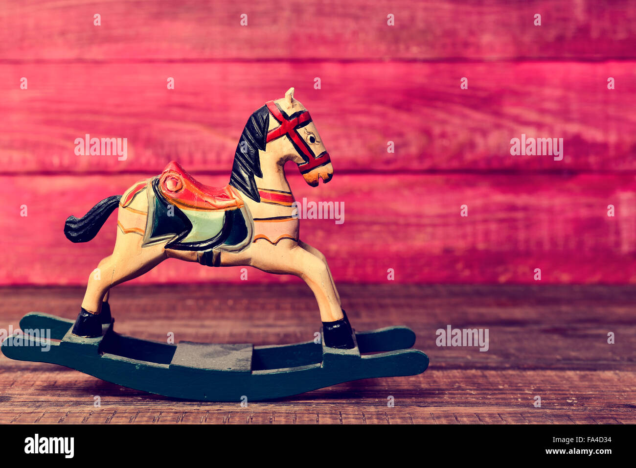 an old wooden rocking horse on a rustic wooden surface Stock Photo - Alamy