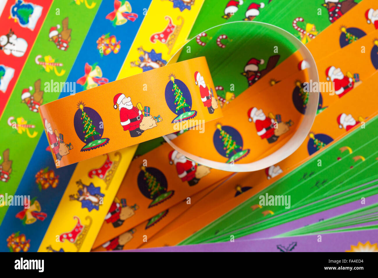 making paper chains decorations for Christmas Stock Photo - Alamy