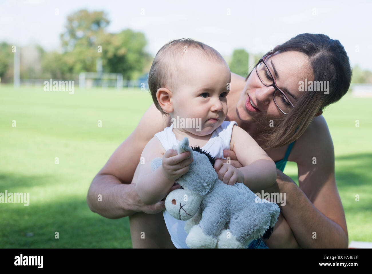 Mother with her baby boy in lawn, Munich, Bavaria, Germany Stock Photo ...