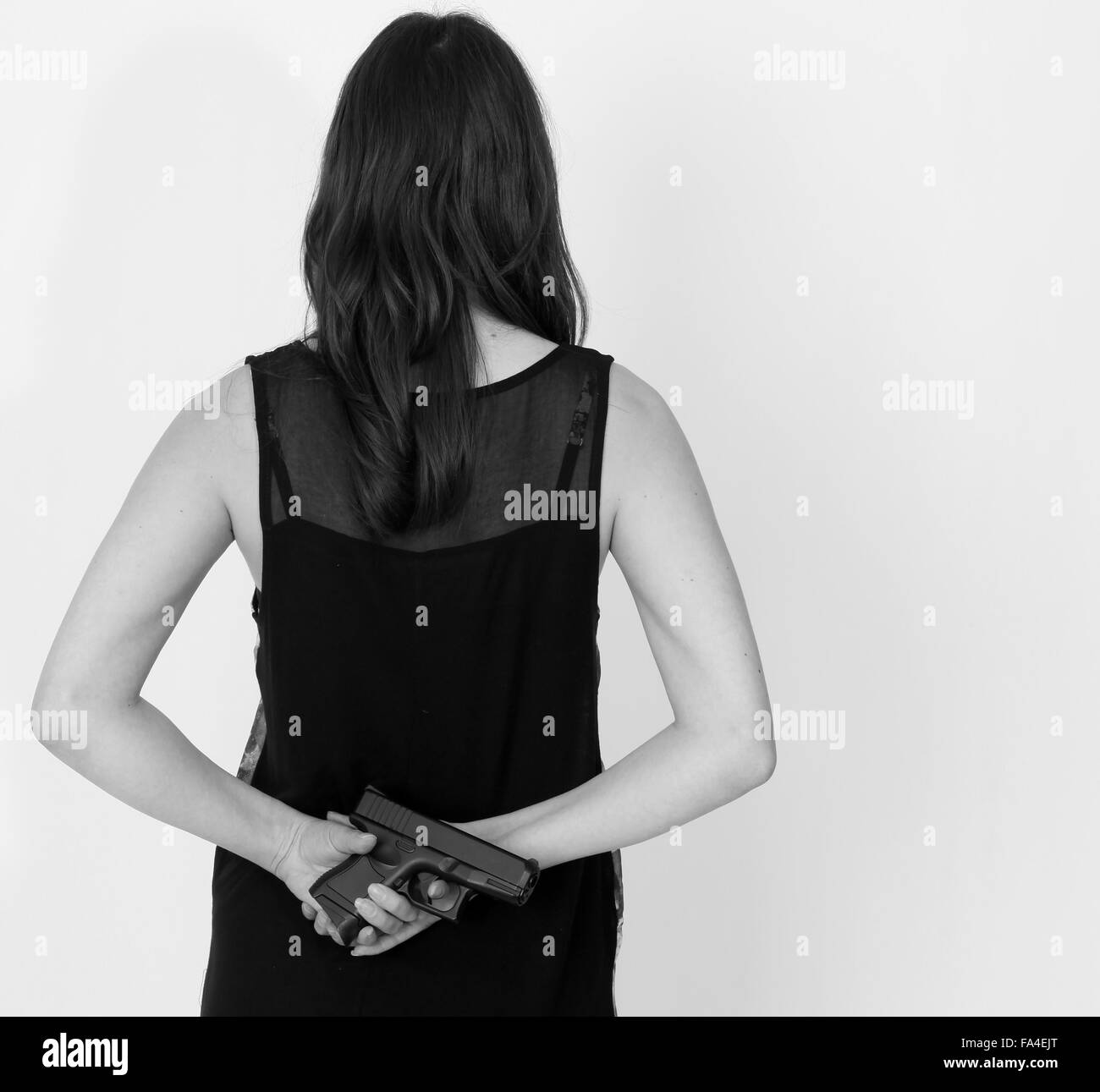 Beautiful woman with a gun Black and White Stock Photos & Images - Alamy
