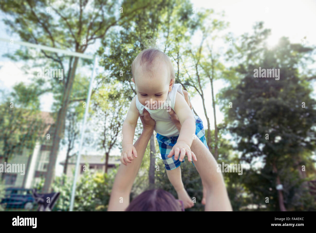 Kid Lifting Kid Stock Photos & Kid Lifting Kid Stock Images - Alamy