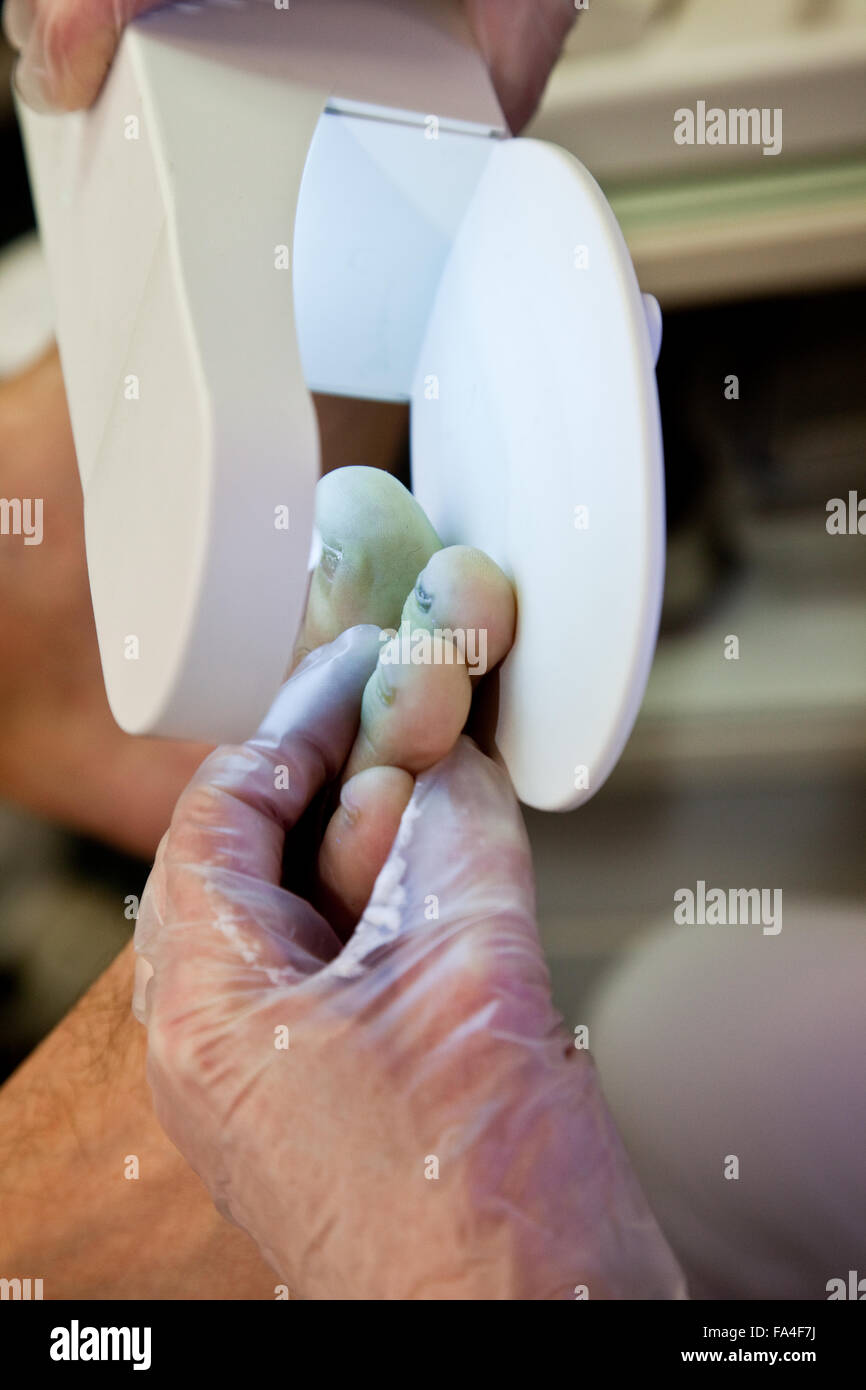 Chiropodist during the chiropody Stock Photo - Alamy