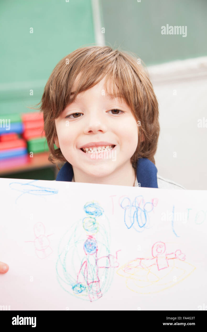 Boy showing a draw Stock Photo - Alamy
