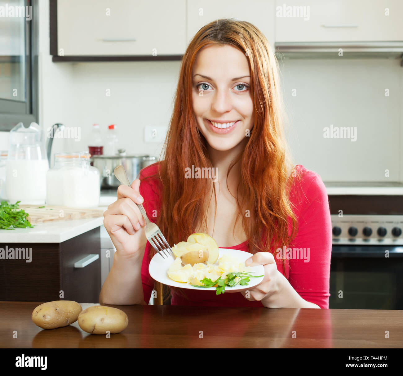 Person eating boiled potatoes hi-res stock photography and images - Alamy