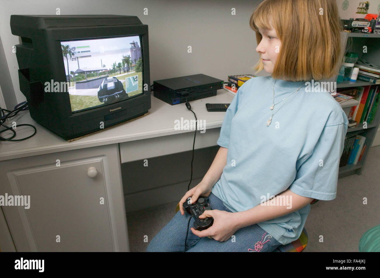 Girl playing a computer game in her bedroom Stock Photo - Alamy