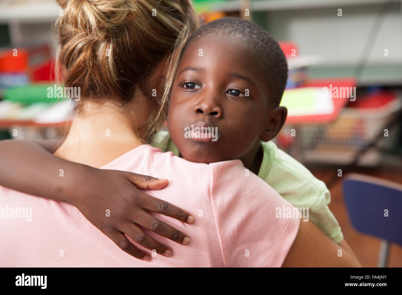 Pupil giving a hug to his teacher Stock Photo - Alamy