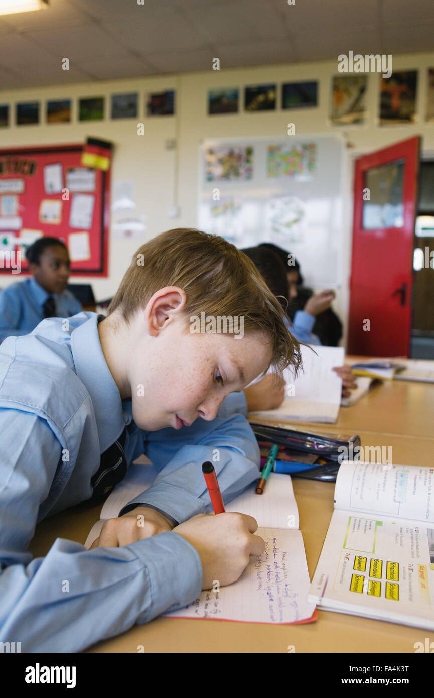 Secondary school student working on an exercise at a desk Stock Photo ...