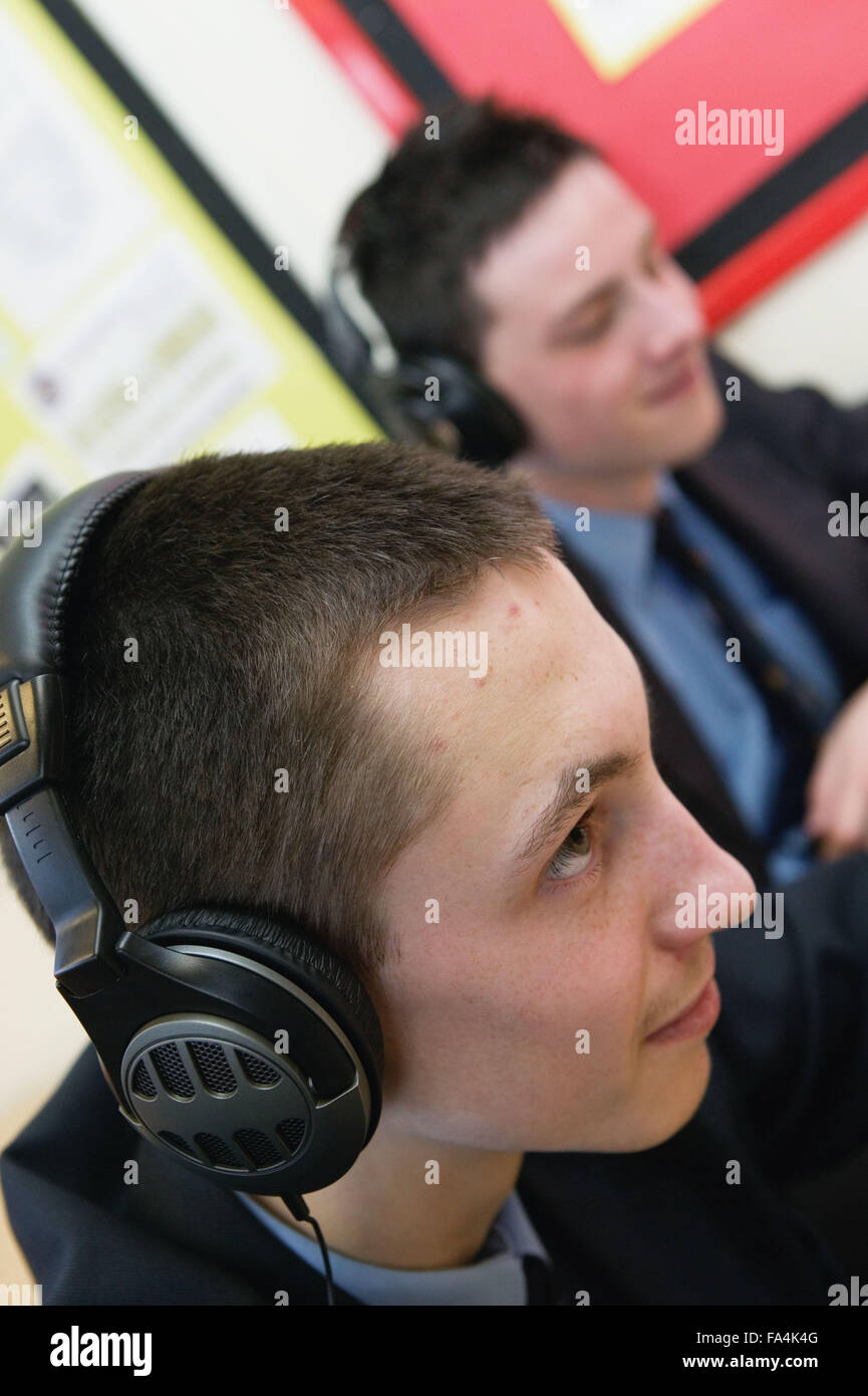 Secondary school students learning languages using headphones Stock ...