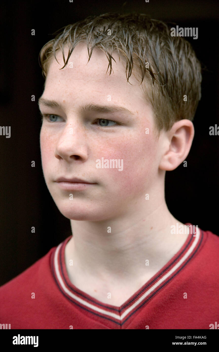 Teenage boy looking serious Stock Photo - Alamy