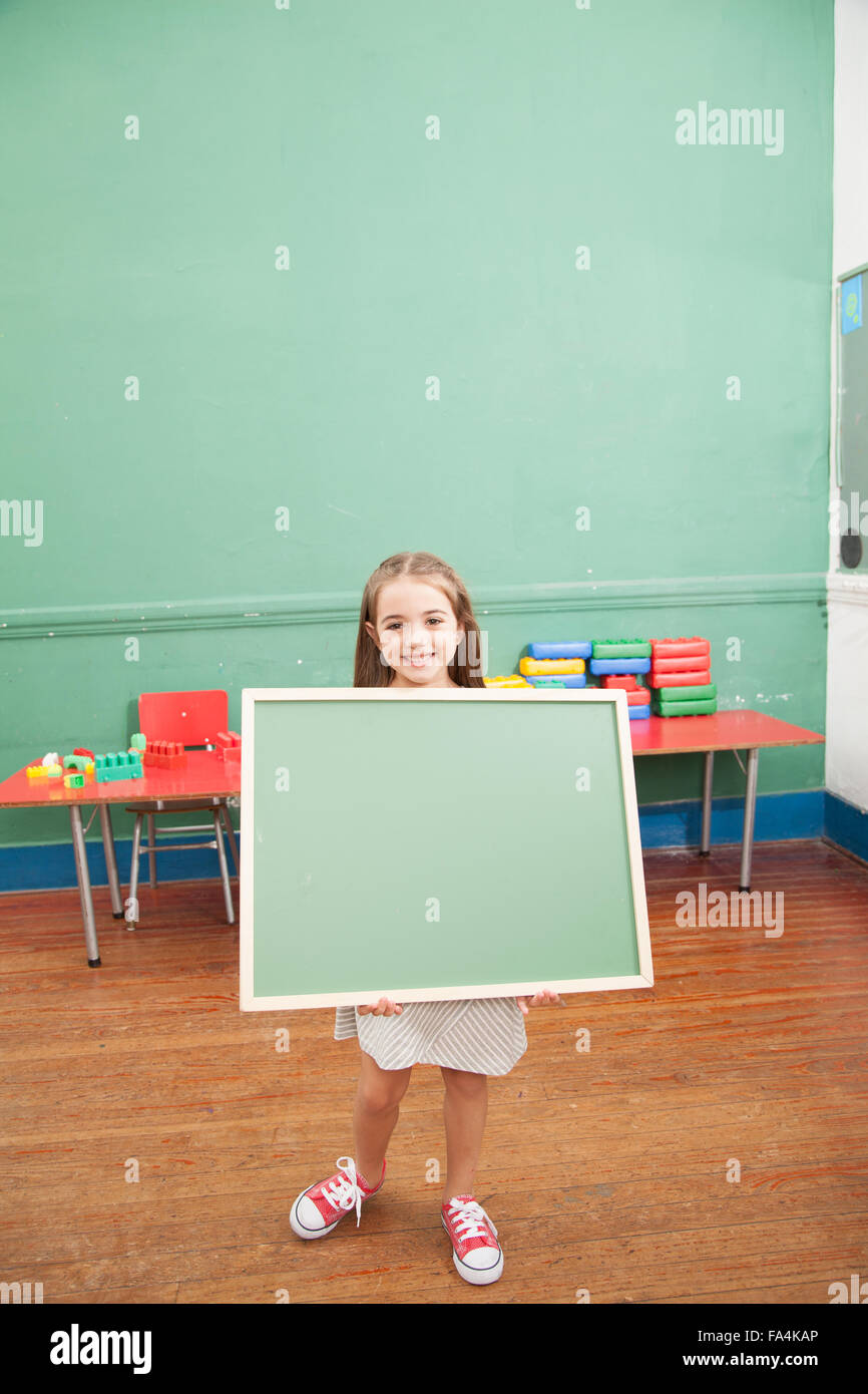 Girl showing a board Stock Photo - Alamy