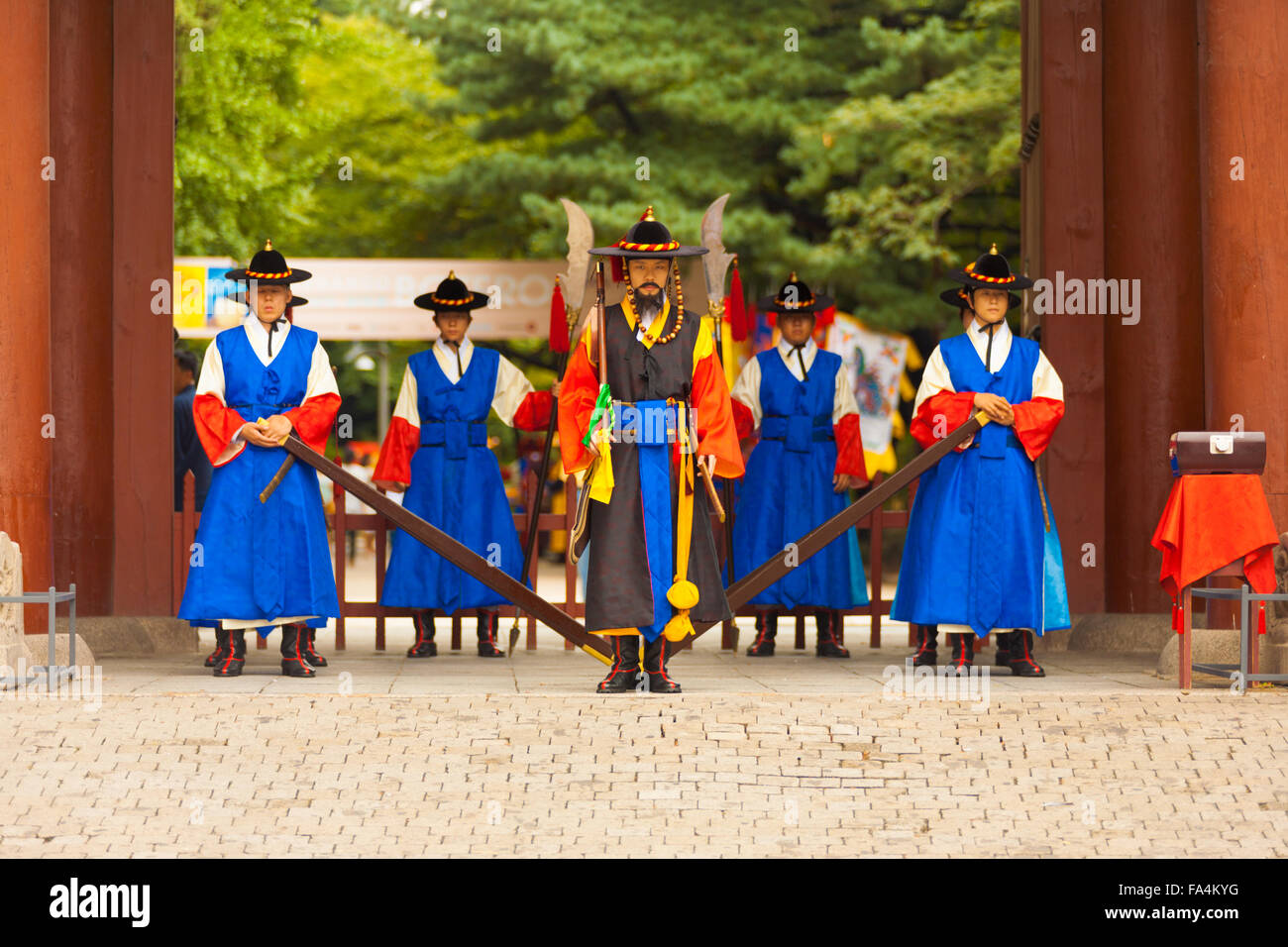 Armed guards in traditional period costume standing at the entry gate ...