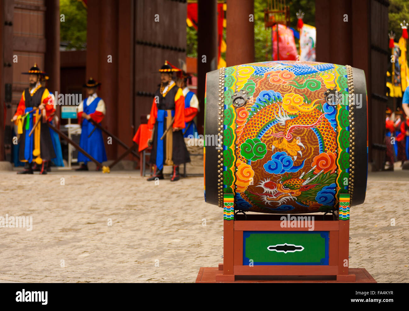 Large traditional Korean painted drum resting at entrance to Deoksugung ...