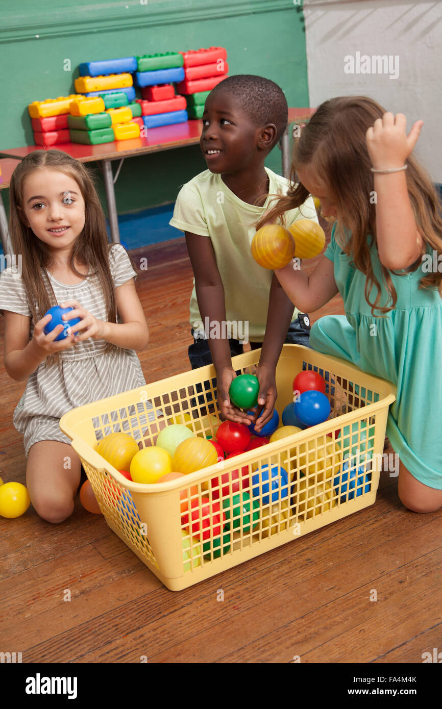 Children playing with the balls Stock Photo - Alamy