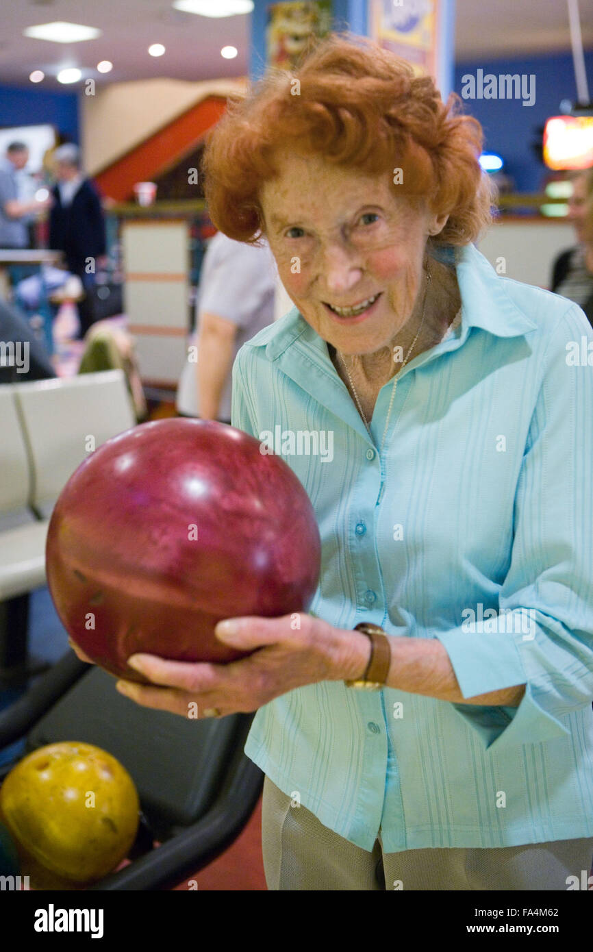 Portrait of an Elderly woman holding ten pin bowling ball Stock Photo ...