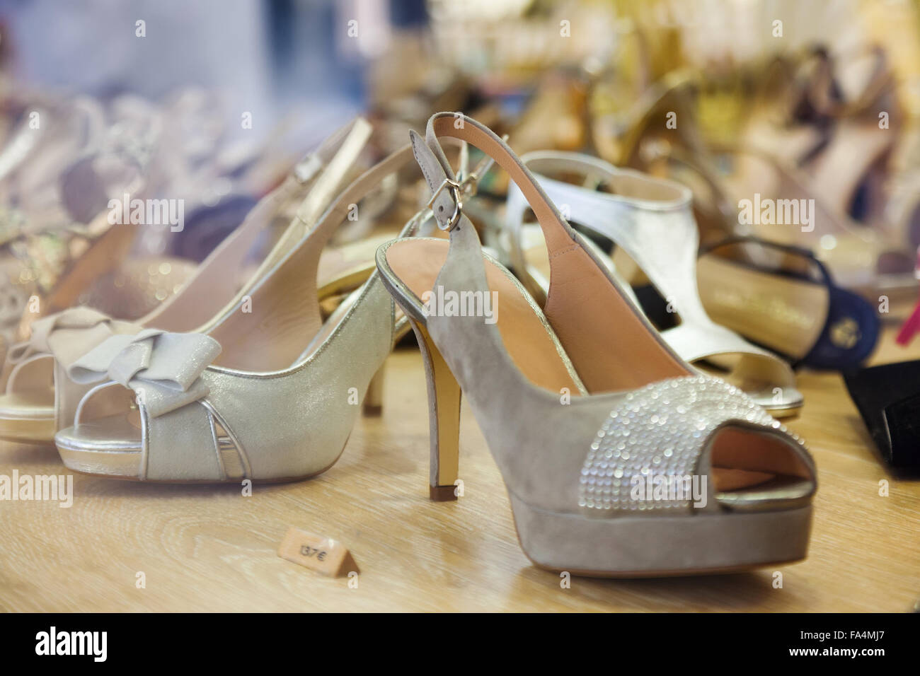 Counter with female shoes at store Stock Photo - Alamy