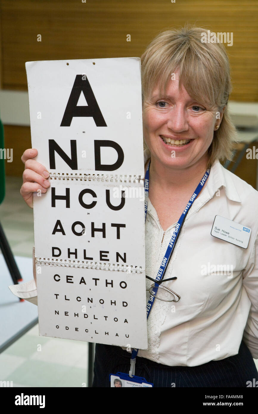 School nurse carrying out eyesight test Stock Photo - Alamy