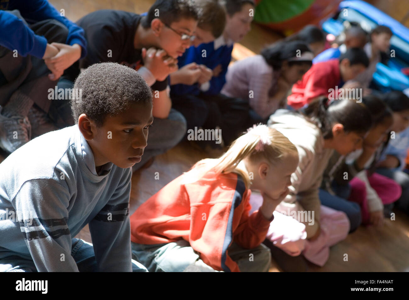 Children school assembly sitting hi-res stock photography and images ...