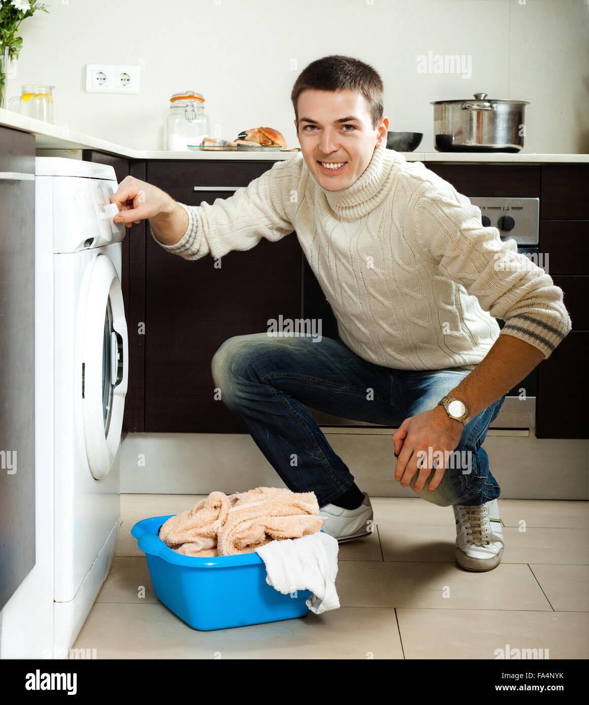 Home laundry handsome man loading hi-res stock photography and images ...