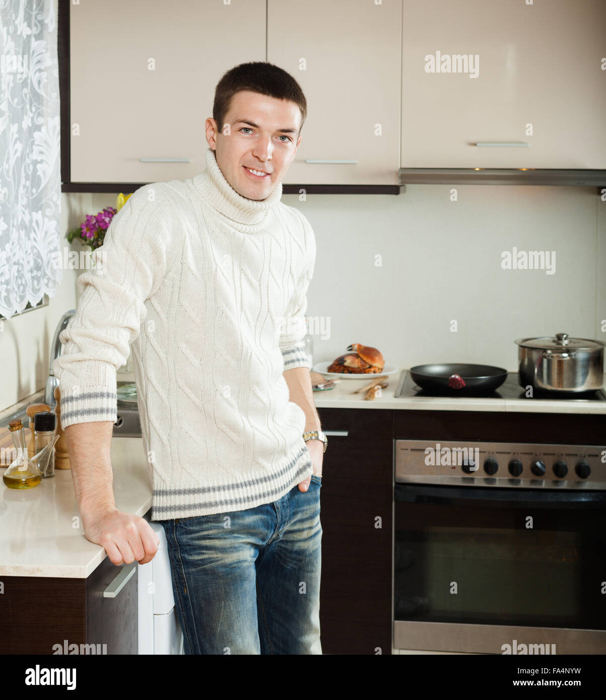 handsome man at kitchen interior Stock Photo - Alamy