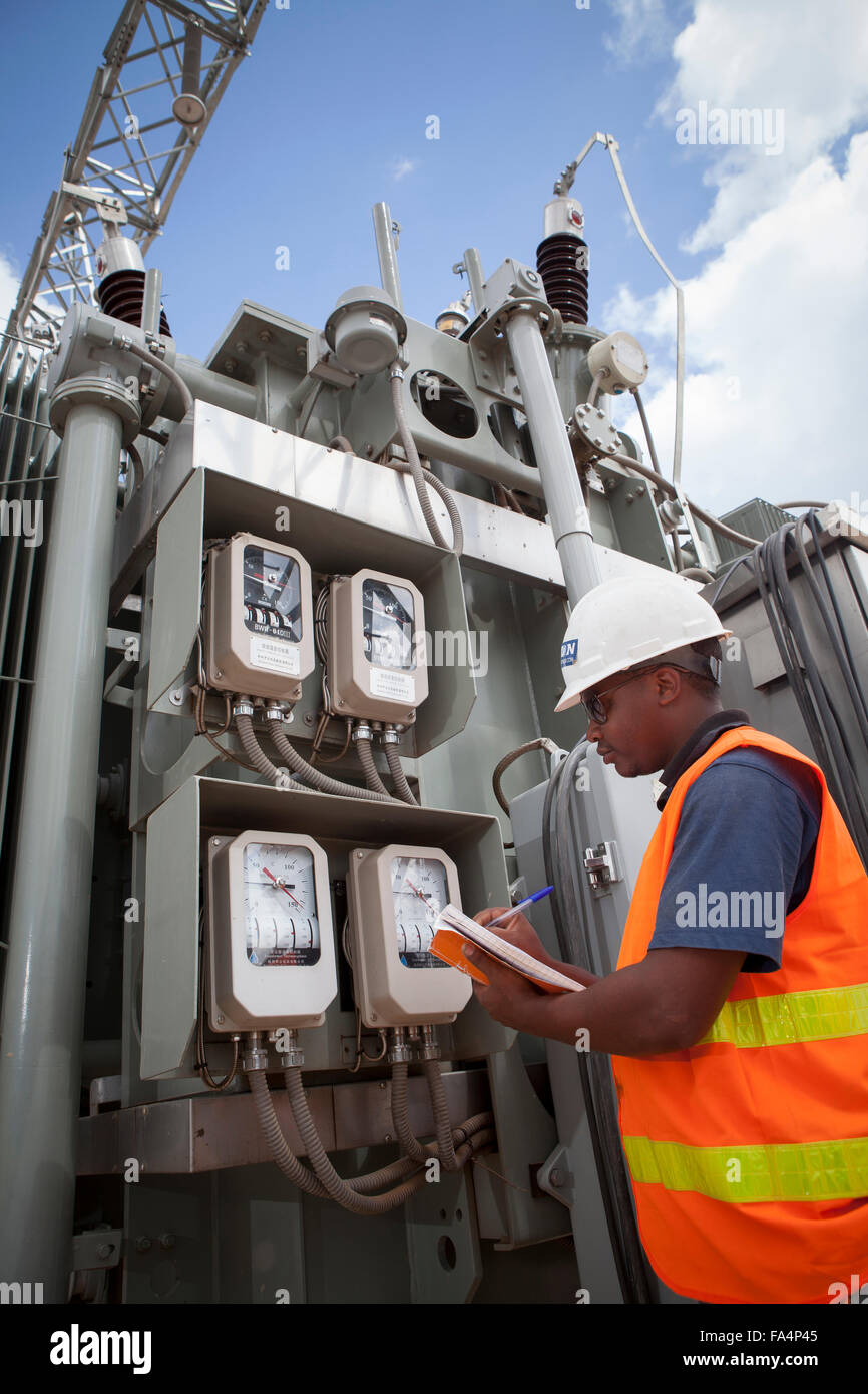 An electrical engineer maintains equipment at Mtoni Service Station in ...