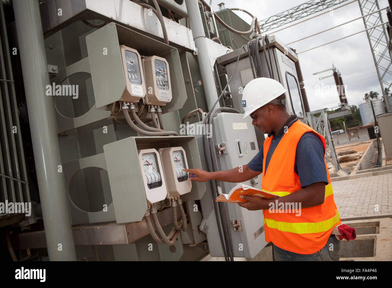 An electrical engineer maintains equipment at Mtoni Service Station in ...