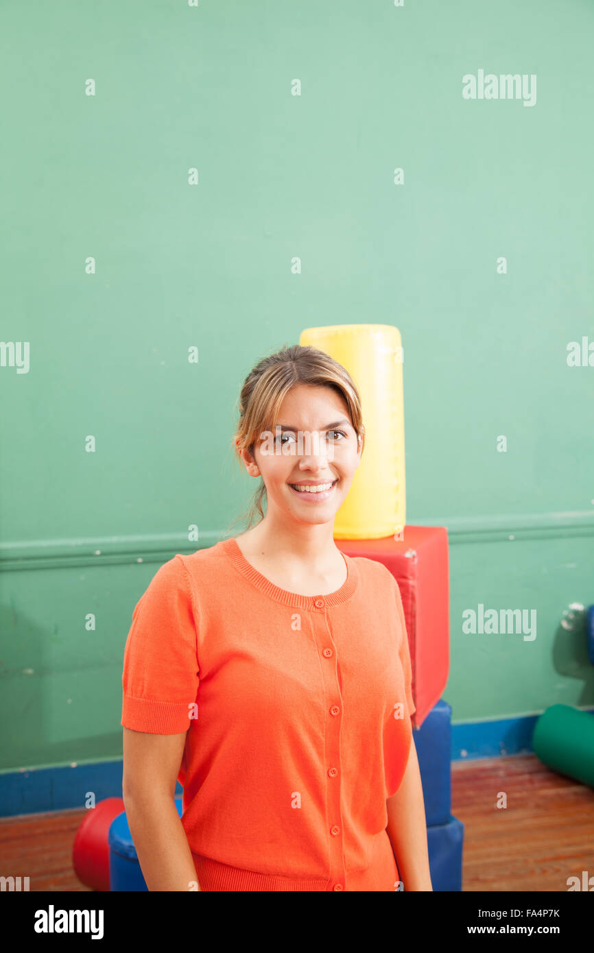 Teacher smiling at school Stock Photo - Alamy