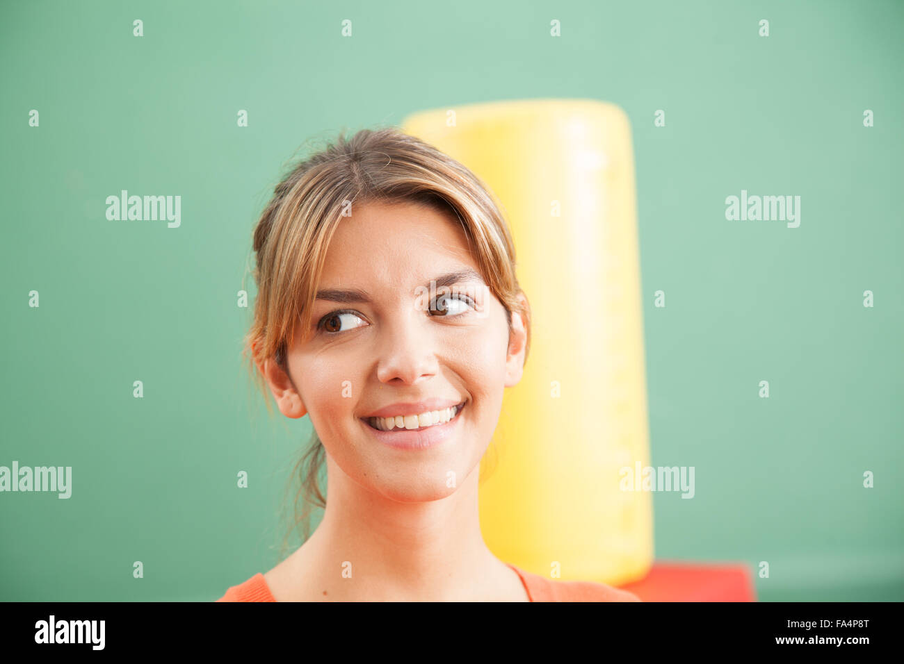 Teacher smiling at school Stock Photo - Alamy