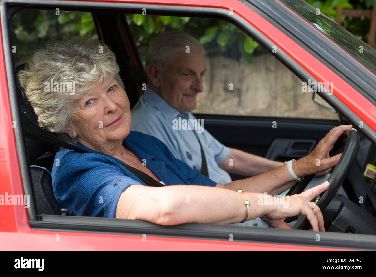 Older woman driving a car Stock Photo - Alamy