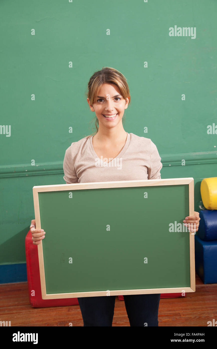 Teacher showing the board Stock Photo - Alamy