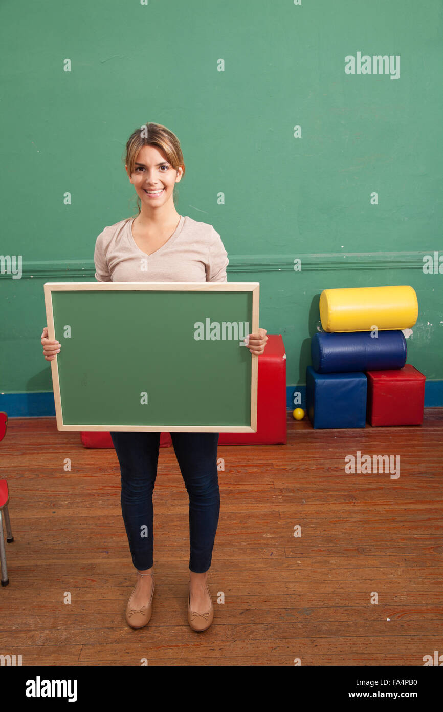 Teacher showing the board Stock Photo - Alamy