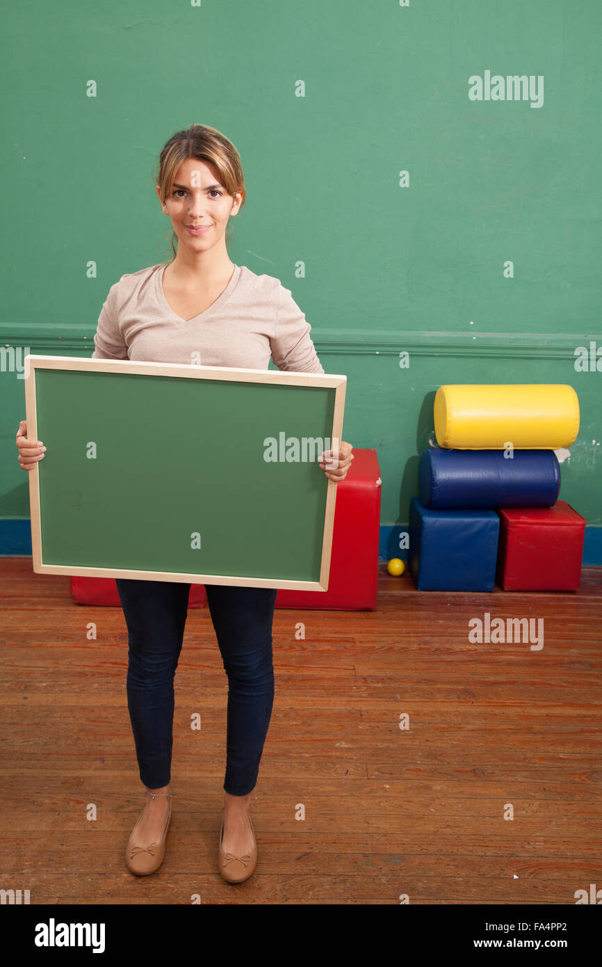 Teacher showing the board Stock Photo - Alamy