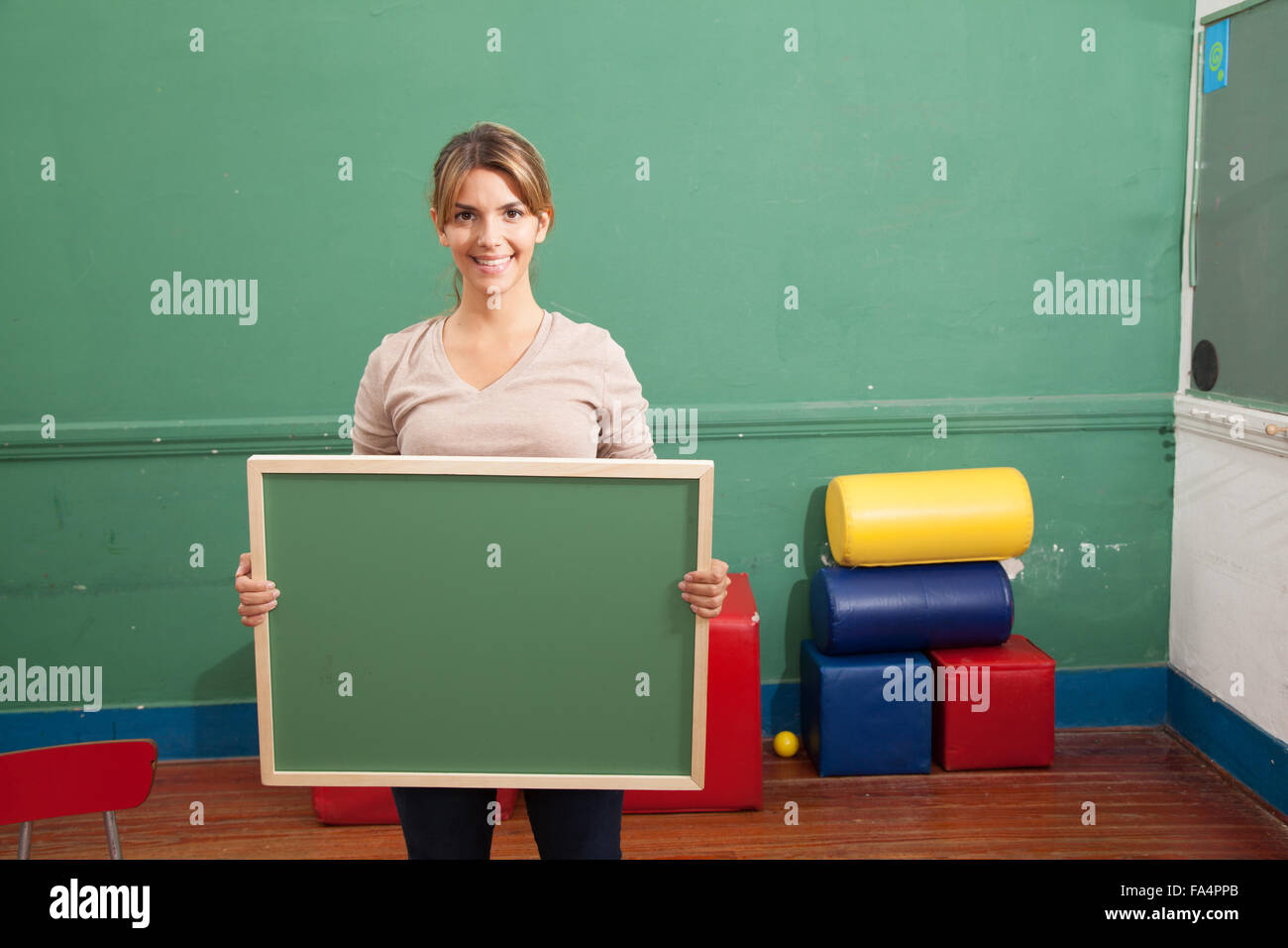 Teacher showing the board Stock Photo - Alamy