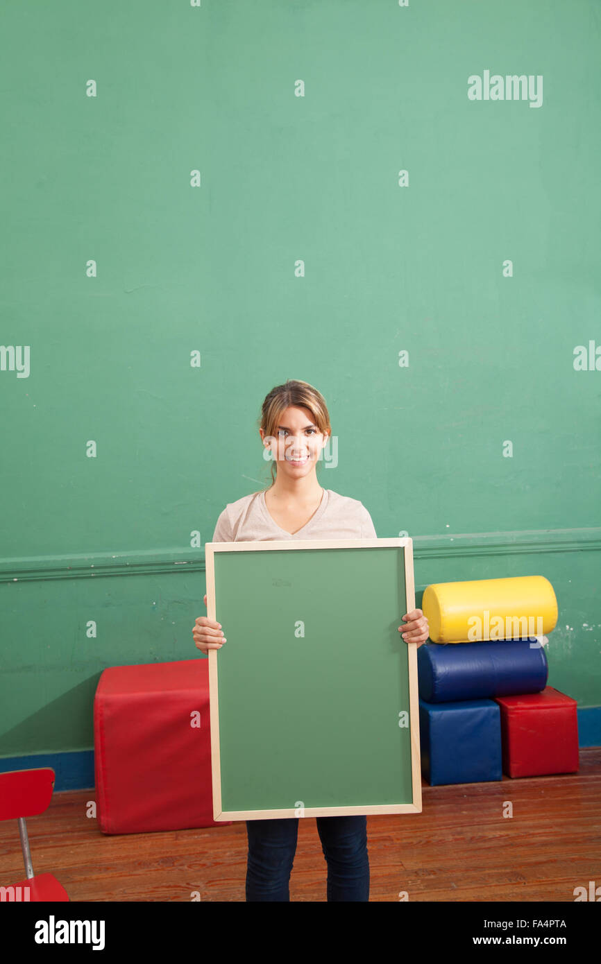 Teacher showing the board Stock Photo - Alamy