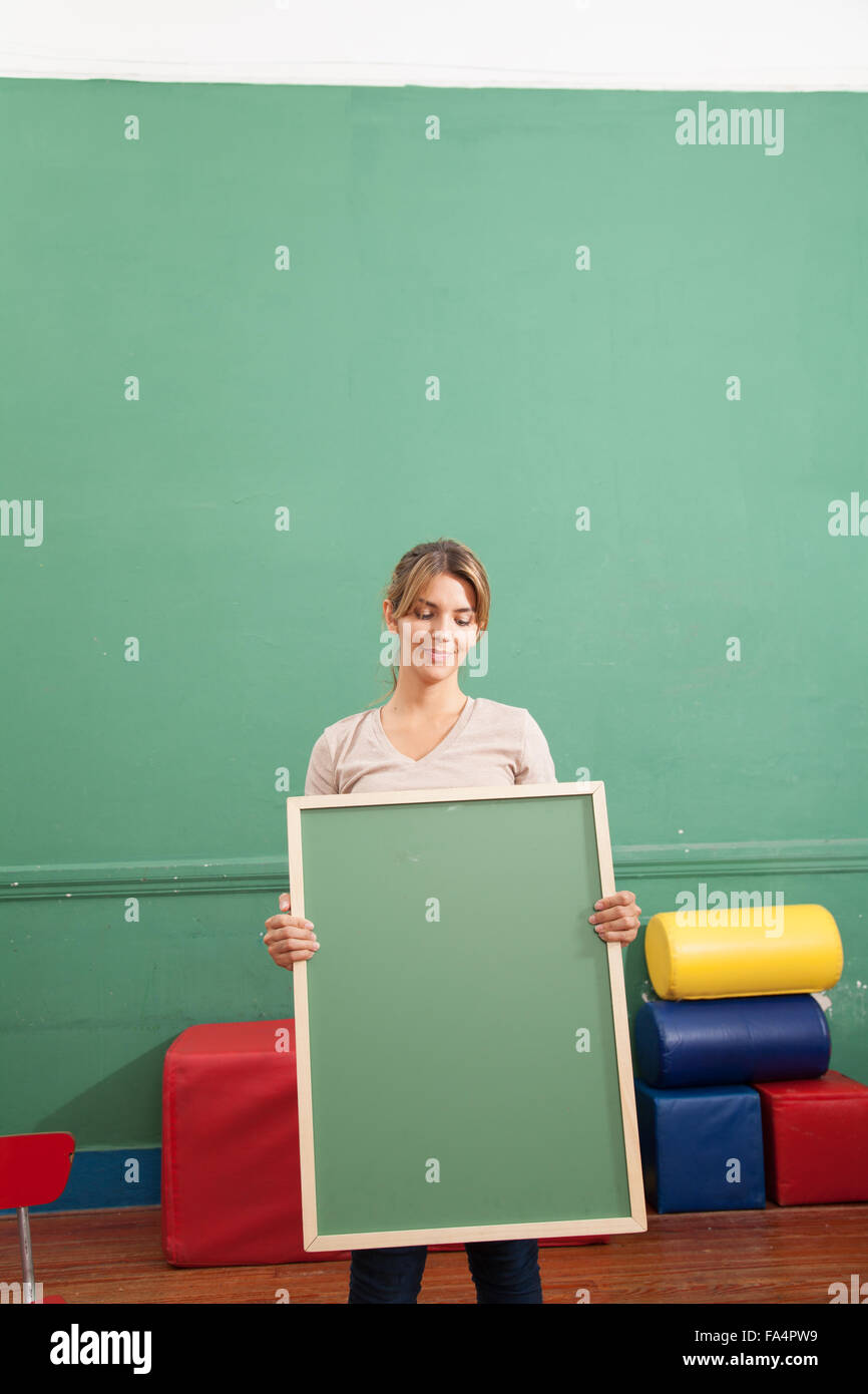 Teacher showing the board Stock Photo - Alamy
