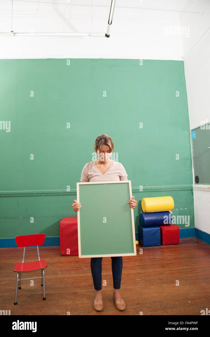 Teacher showing the board Stock Photo - Alamy
