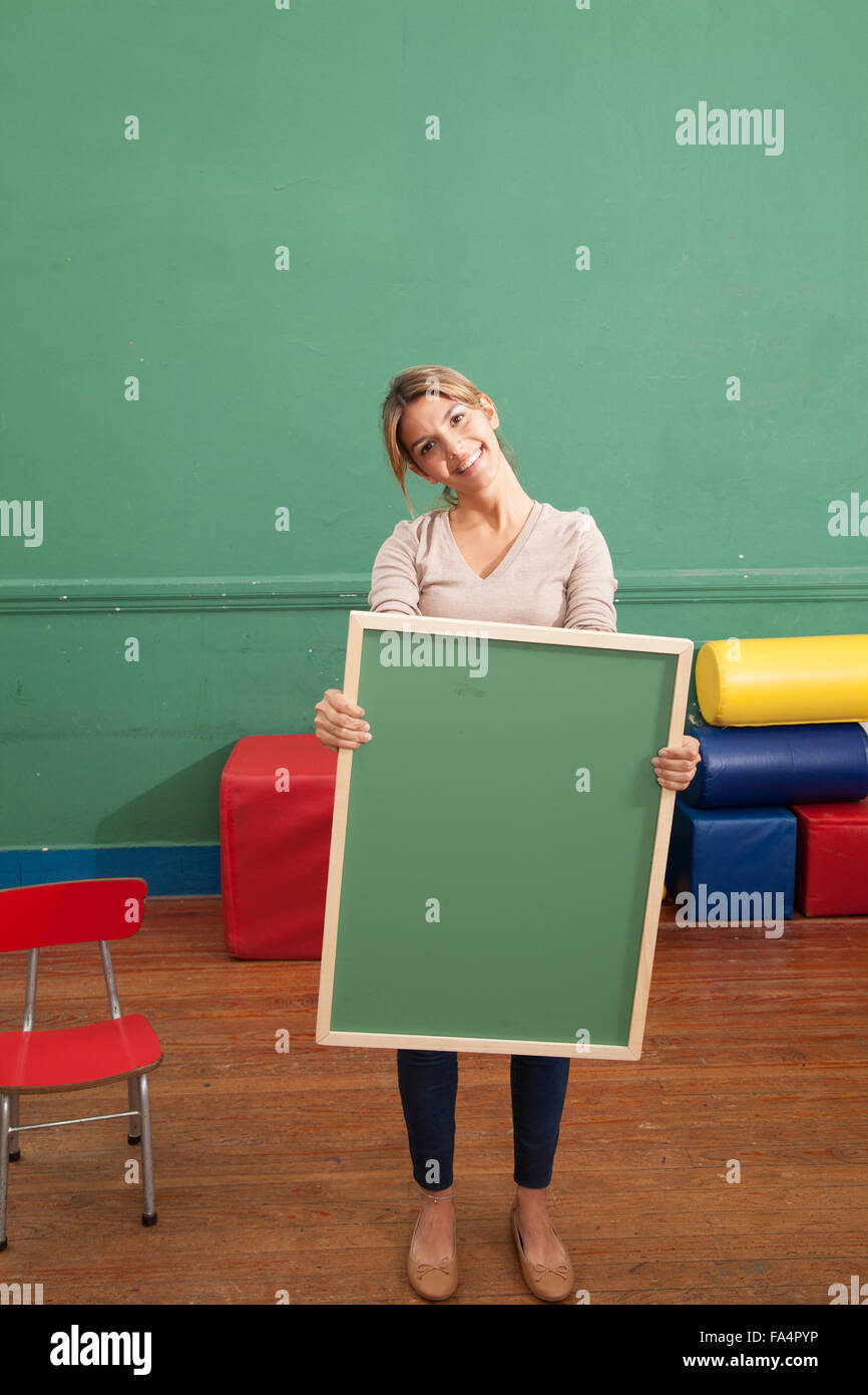 Teacher showing the board Stock Photo - Alamy