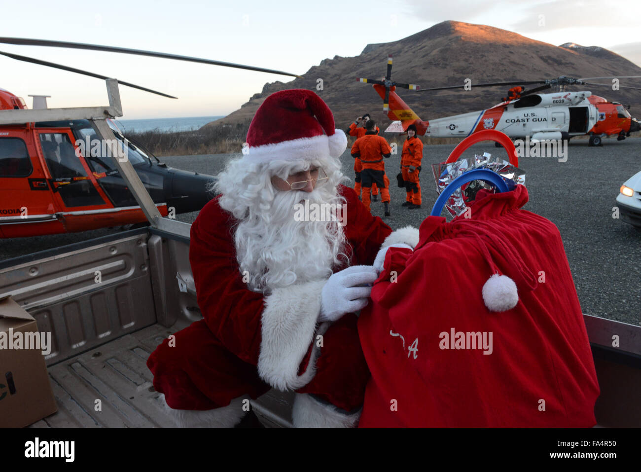 Santa Claus prepares his bag of presents after arriving to visit ...