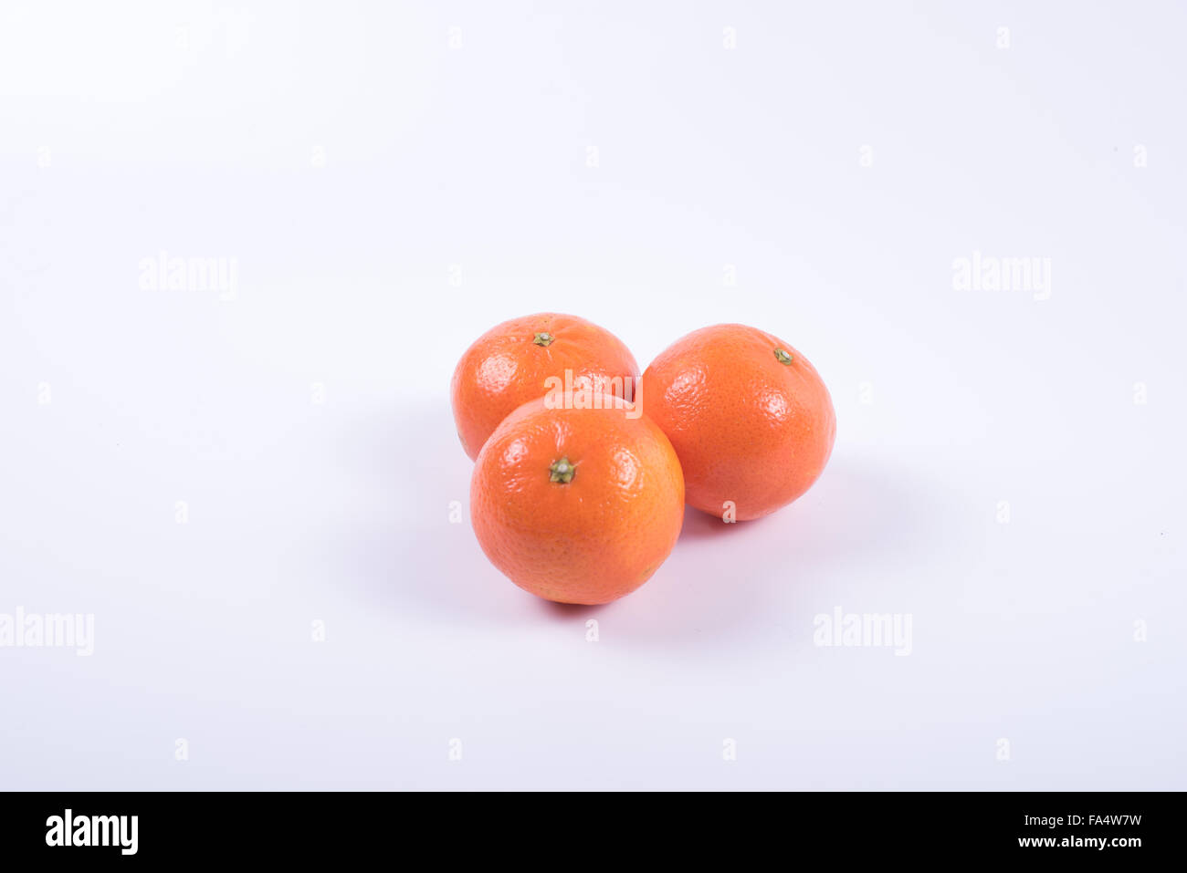 close up of three tangerines isolated on white background Stock Photo ...