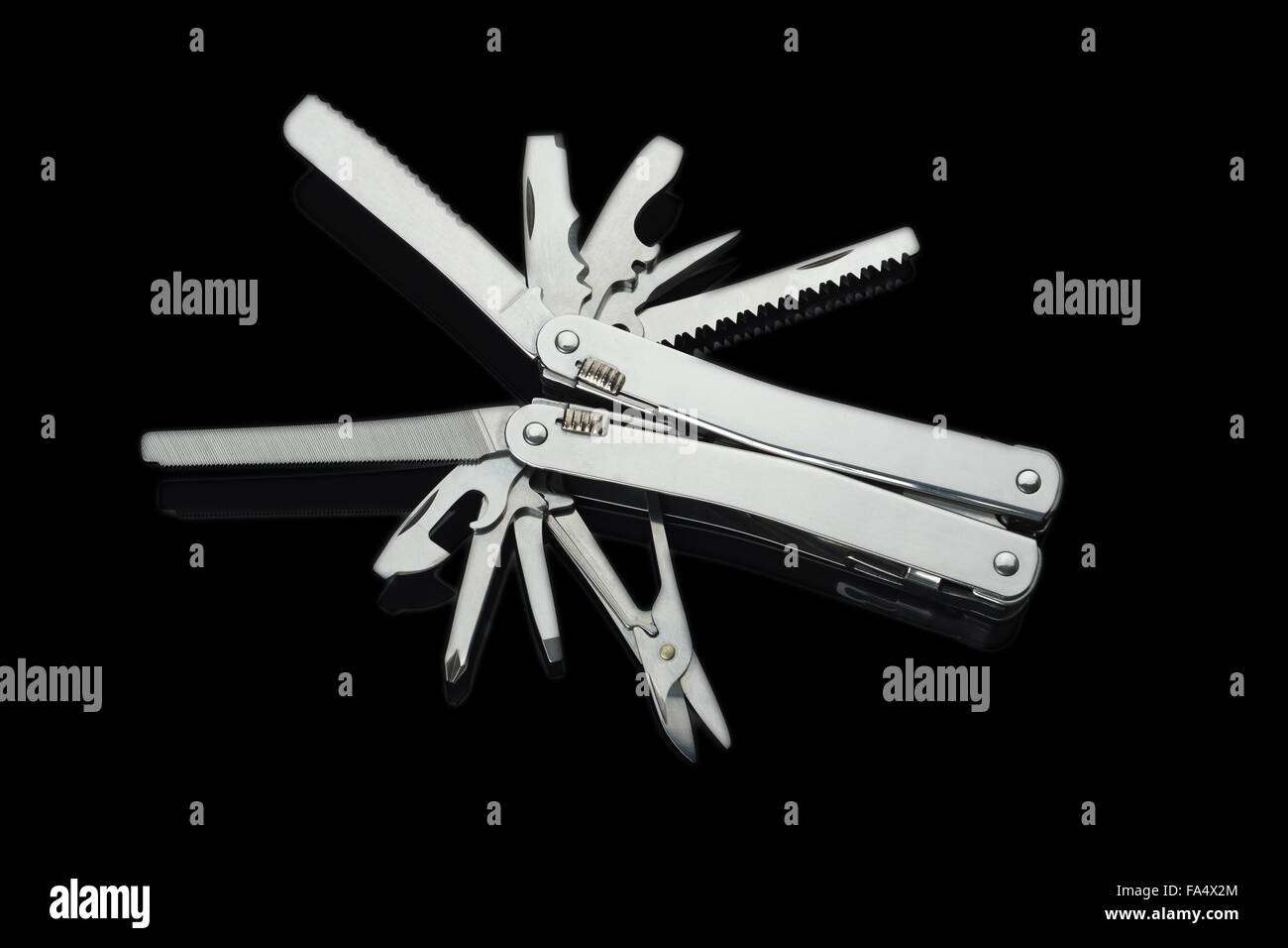 Stainless steel army knife multitool isolated on black Stock Photo - Alamy