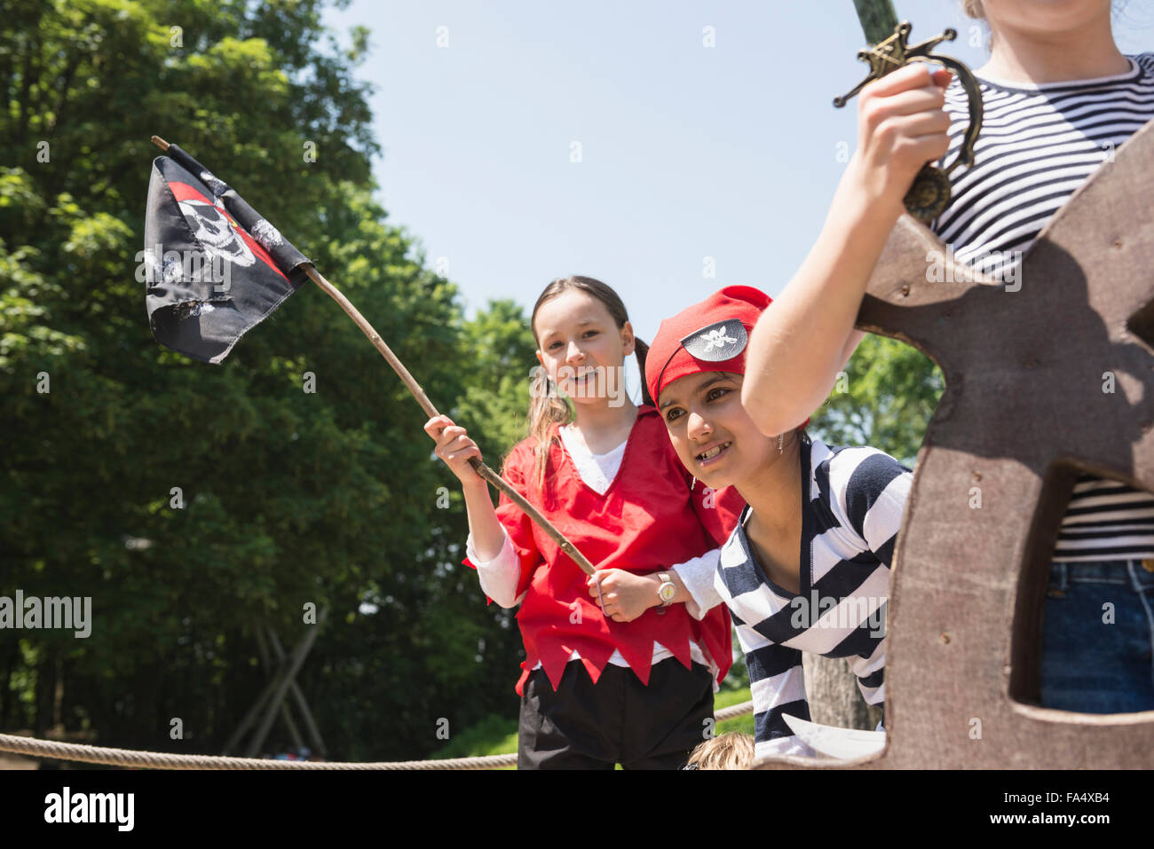 Girls playing pirate game in adventure playground, Bavaria, Germany ...