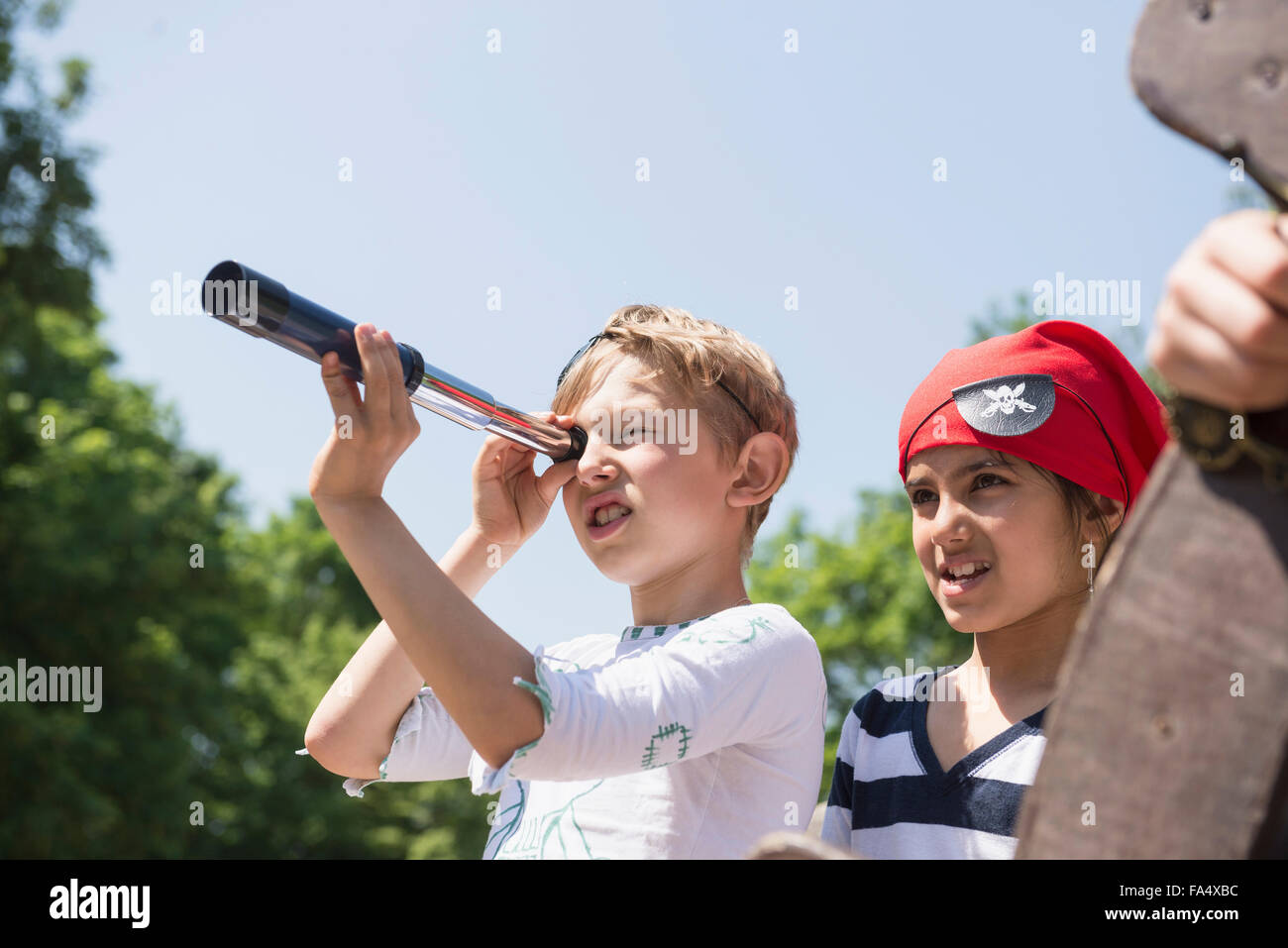 Children playing pirate game in adventure playground, Bavaria, Germany ...