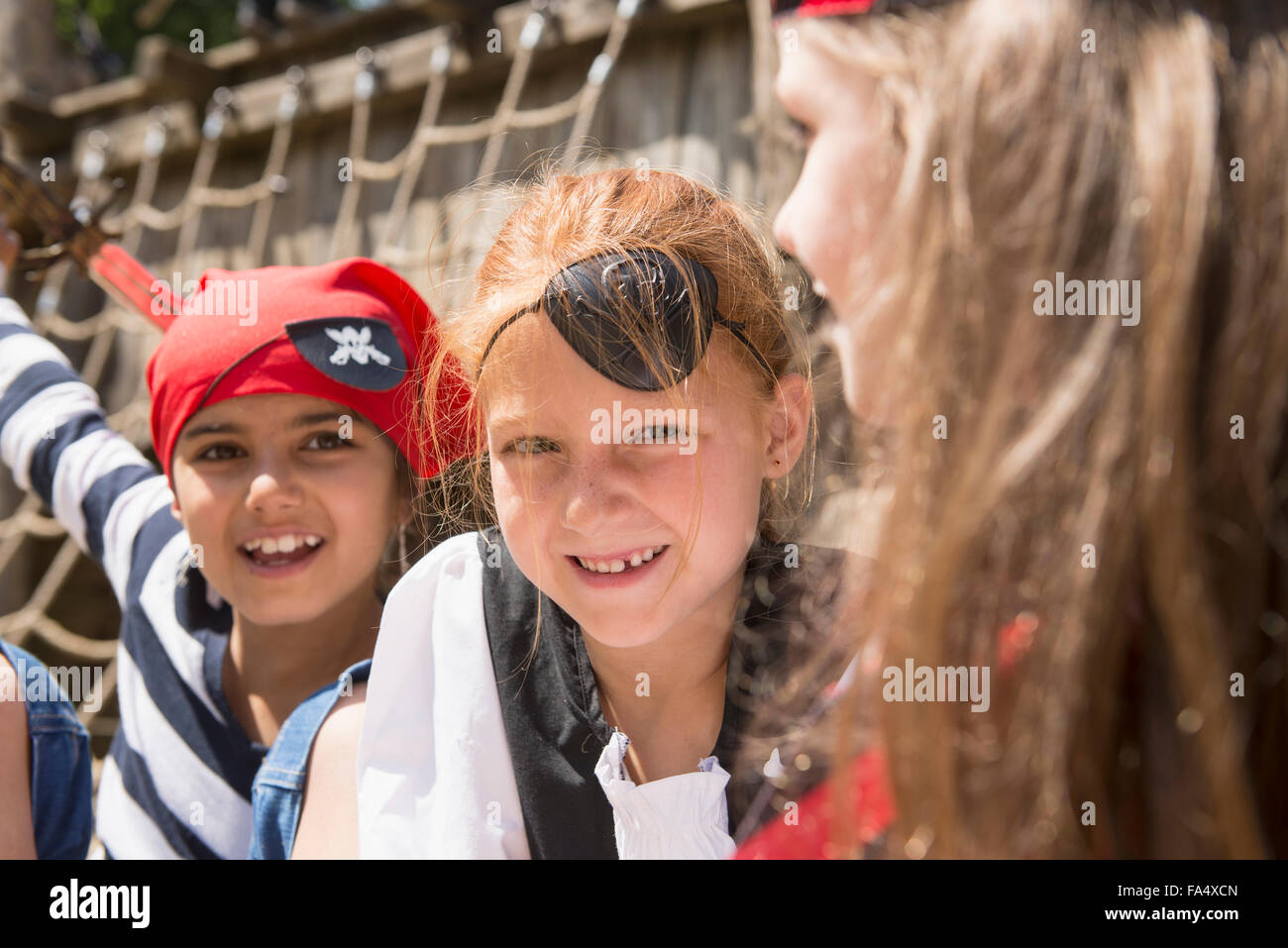 Three girls smiling in a playground, Bavaria, Germany Stock Photo - Alamy