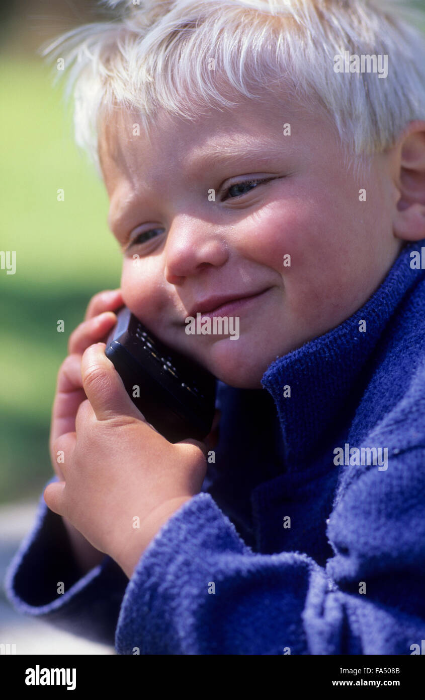 Young boy on mobile phone Stock Photo - Alamy