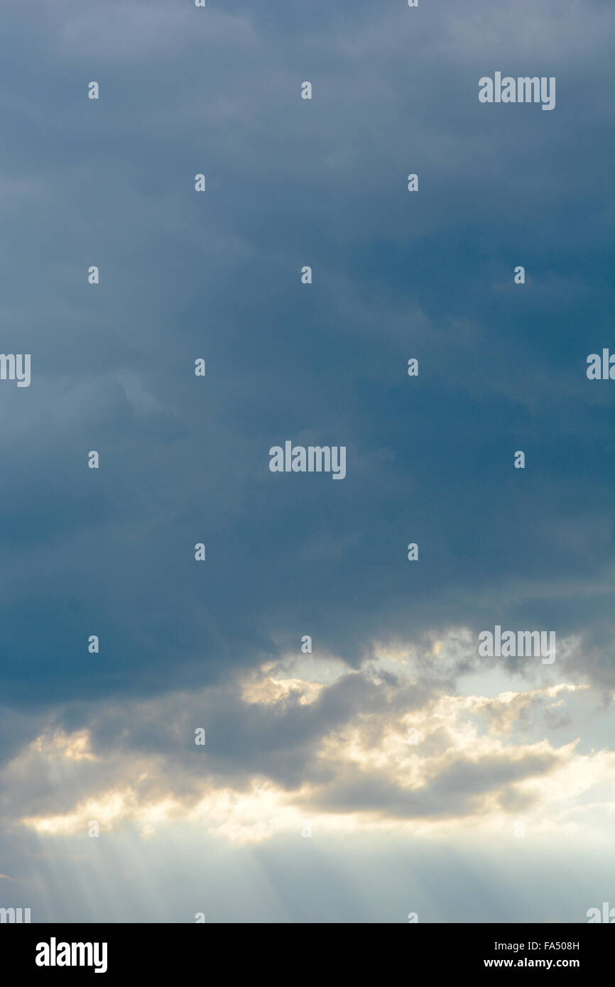 Overcast day sun beam through the clouds Stock Photo - Alamy